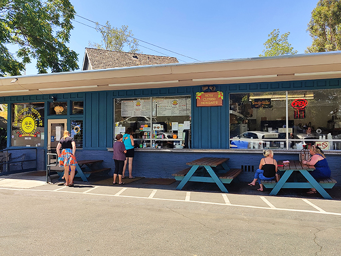 Buttercup's turquoise exterior isn't just a building—it's an invitation. Those picnic tables have witnessed more food epiphanies than a cooking show marathon.