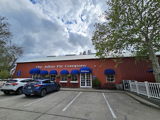 The iconic red exterior with bright blue awnings beckons pie lovers like a beacon of hope in a world of mediocre desserts.