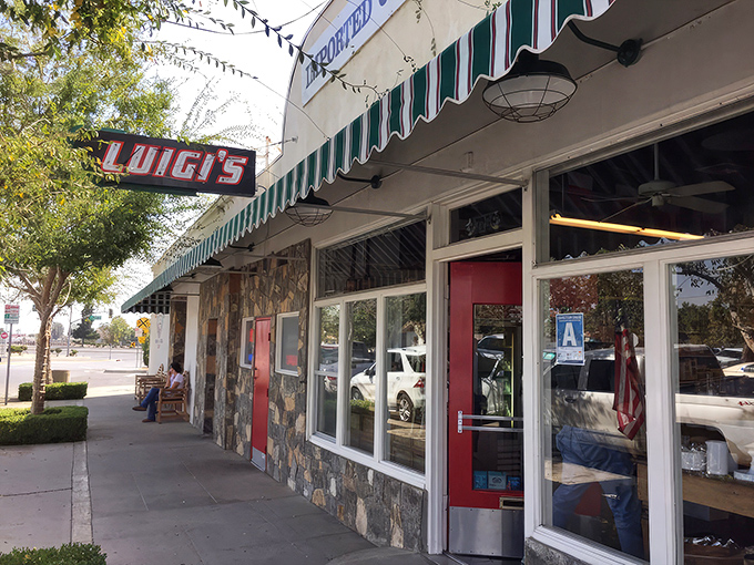 Luigi's classic storefront beckons with its vintage sign and green-striped awning—a time capsule of Italian-American tradition standing proudly in Bakersfield.