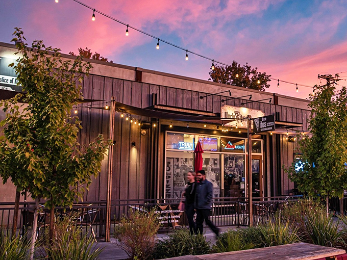 The perfect California-meets-New York moment: Uncle Vito's outdoor seating area, where Sacramento sunshine meets East Coast pizza tradition under those inviting red awnings.