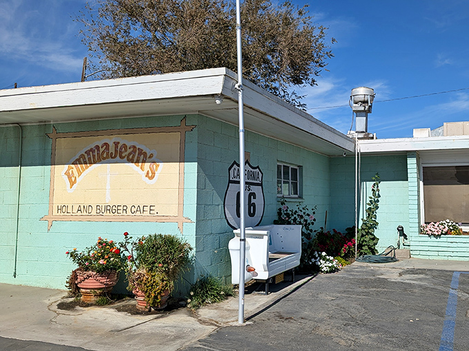 The mint-turquoise exterior isn't just a building—it's a time machine with a Route 66 shield as your boarding pass. 