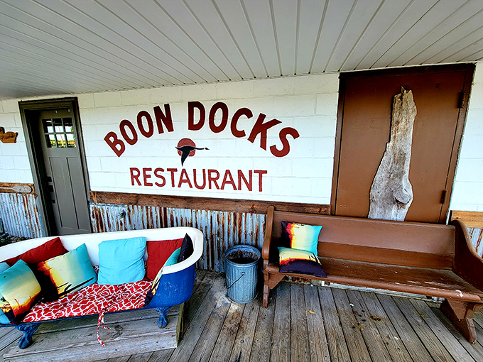 The unassuming facade of Boondocks promises little but delivers culinary treasures. That bathtub sofa? Pure genius – comfort meets coastal quirk.