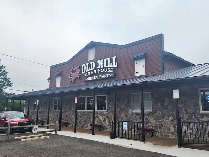 The iconic red exterior of Old Mill Crab House stands proudly in Delmar, where that giant crab sign has been beckoning hungry travelers for decades.