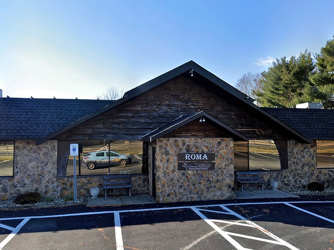 The stone facade of Roma stands like a rustic Italian villa transplanted to Dover, promising culinary adventures behind those wooden beams.