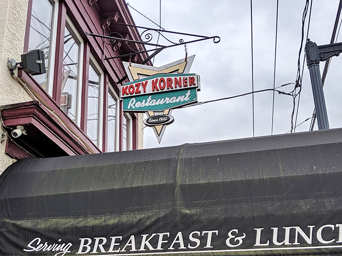 That vintage neon sign hanging above Kozy Korner isn't just advertising – it's a time portal to when diners were the social media of their day.