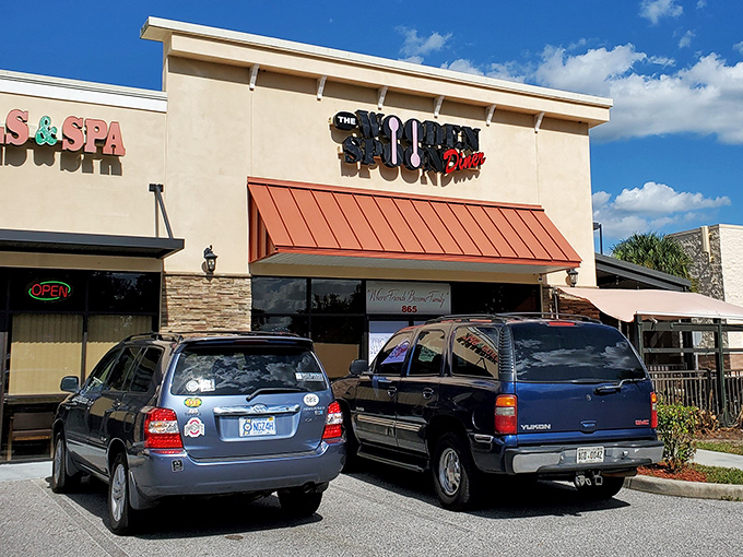 The welcoming exterior of The Wooden Spoon Diner beckons hungry travelers with its covered patio—Florida's answer to sidewalk cafés without the sunburn.