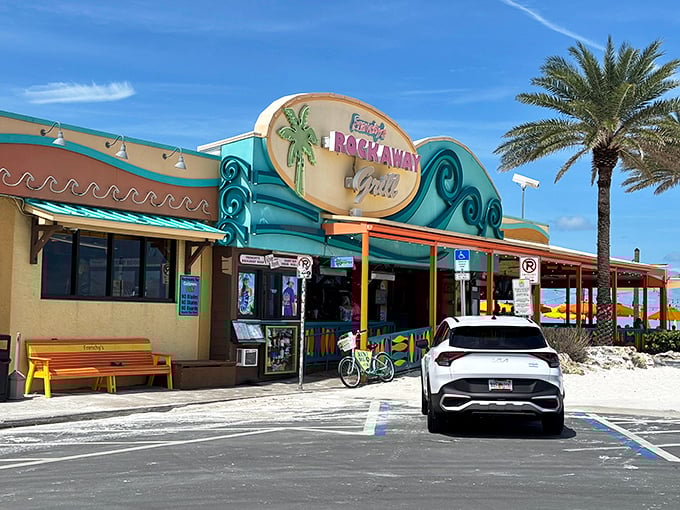 The turquoise and coral exterior of Frenchy's Rockaway Grill stands like a tropical mirage against Clearwater's pristine white sand beach.