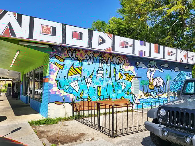 That vibrant mural outside Woodchuck's practically shouts "Come on in!" – and trust me, you'll want to listen.