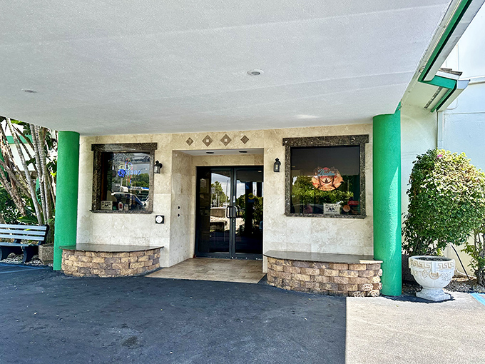 The iconic green pillars of Peter Pan Diner stand like sentinels guarding a treasure trove of comfort food classics in Oakland Park.