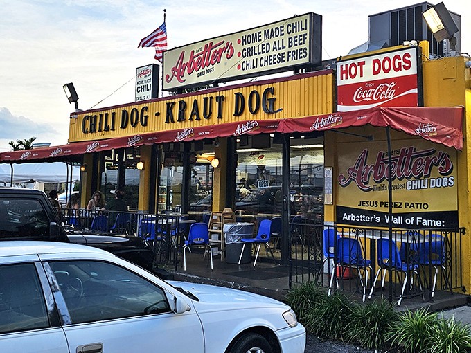That bright yellow facade isn't just a building—it's a beacon of hope for the hungry. The Jesus Perez Patio beckons with the promise of chili dog nirvana.