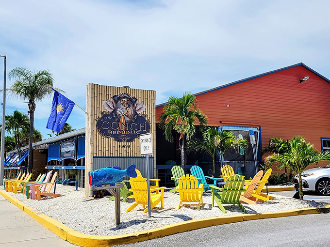 Those rainbow Adirondack chairs aren't just for show—they're an invitation to slow down and savor life, Florida-style. The Conch Republic's vibrant exterior sets the perfect tone for what awaits inside.