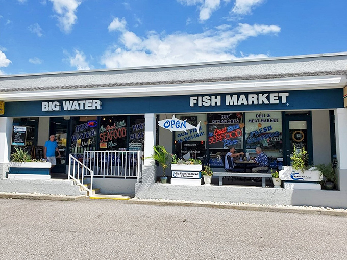 The teal storefront beckons like a siren call to seafood lovers. This unassuming strip mall gem houses treasures fresher than your uncle's retirement jokes.
