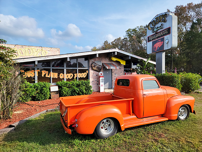 The iconic yellow exterior and corrugated metal trim of Cody's Original Roadhouse stands as a beacon for hungry travelers seeking authentic roadhouse fare in Crystal River.