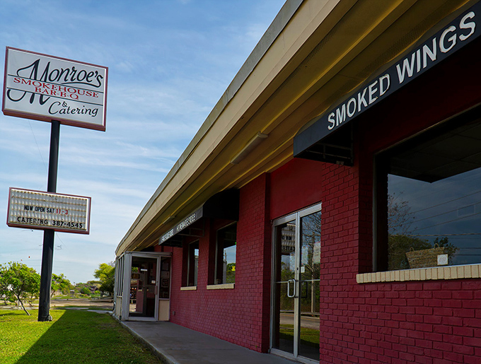 The burgundy building beckons like a smoke signal to barbecue pilgrims. Monroe's modest exterior hides Jacksonville's worst-kept secret—extraordinary smoked meats await inside. 