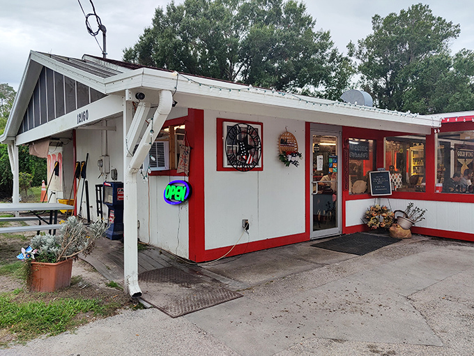 The unassuming red and white exterior might fool you, but Florida BBQ pilgrims know better—culinary magic happens behind these humble walls.