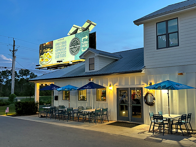 A coastal dream in white and blue, Down Island's exterior promises seafood adventures with its crisp architecture and welcoming porch.