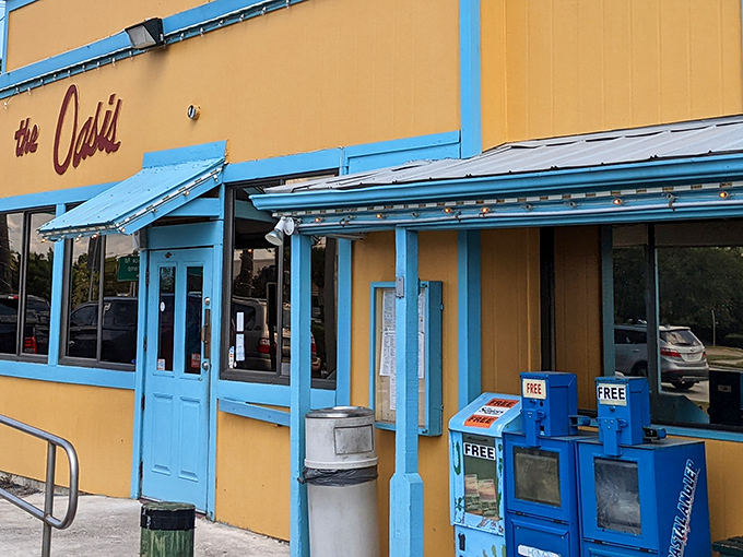 The sunshine-yellow exterior of the Oasis isn't just a building—it's a mood-altering device that instantly transports you to vacation mode.