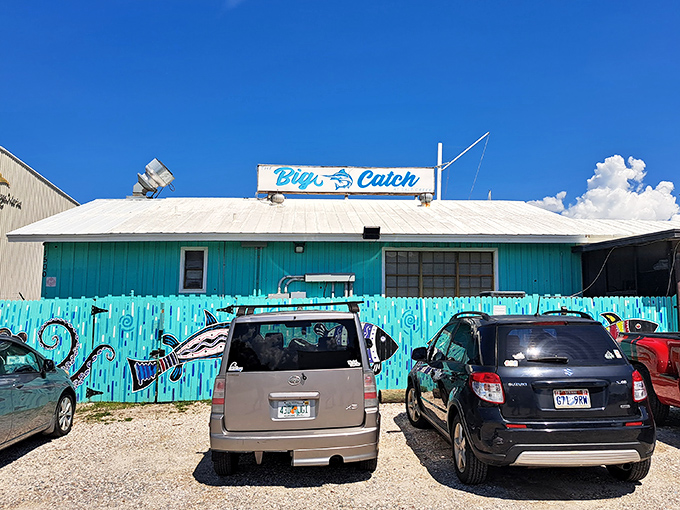 The turquoise facade of The Big Catch isn't trying to hide – it's proudly announcing that Florida seafood magic happens here. No pretense, just promise.