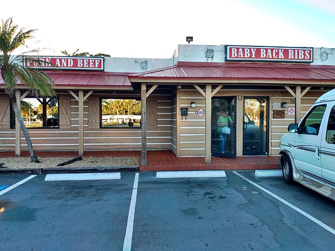 The unassuming wooden exterior of Smoke'n Pit screams "authentic barbecue inside!" Those rooftop signs aren't lying—this place means serious meat business.