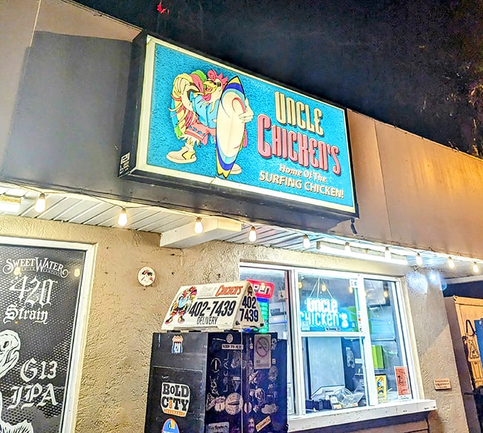 The neon blue glow of Uncle Chicken's at night isn't just a beacon for hungry travelers—it's practically a lighthouse for flavor-seeking souls.