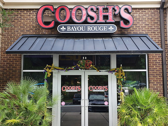 The brick façade and bold red signage of Coosh's Bayou Rouge beckons like a siren song to hungry Tallahassee locals seeking Cajun comfort.