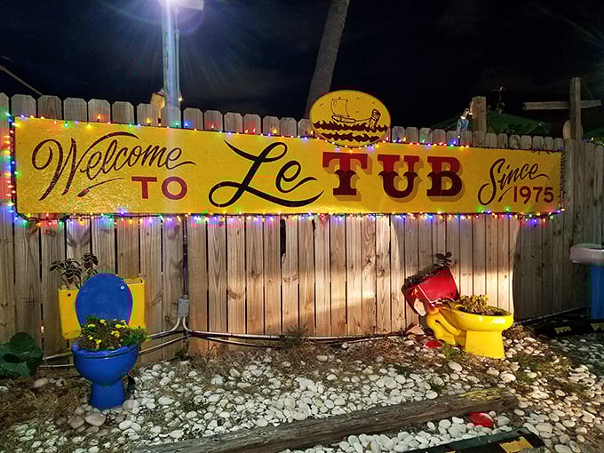 That weathered yellow sign isn't just welcoming you—it's practically begging you to discover Florida's best-kept seafood secret.