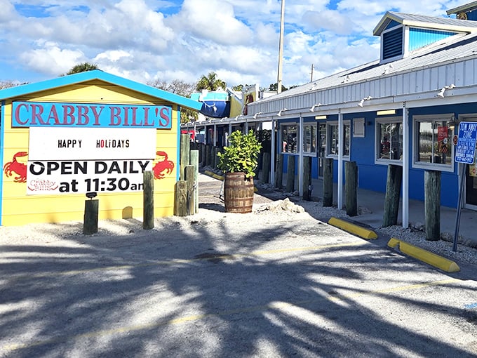 The cheerful yellow and blue exterior of Crabby Bill's stands out like a beacon of seafood hope on Indian Rocks Beach, promising fresh catches and Florida charm.