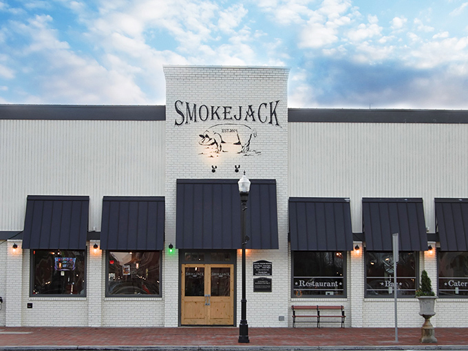 Smokejack's classic white brick exterior stands proud in downtown Alpharetta, where the aroma of hickory smoke serves as the neighborhood's most enticing welcome mat.