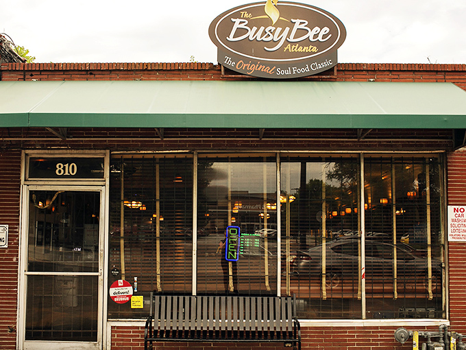 The iconic Busy Bee sign beckons hungry souls like a golden lighthouse in a sea of Atlanta hunger. Soul food salvation awaits inside. 