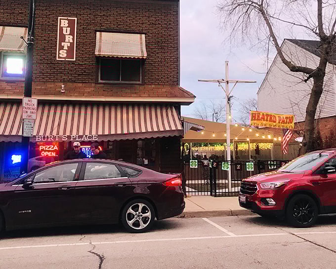 The unassuming brick exterior of Burt's Place hides pizza greatness like Clark Kent's glasses hide Superman. That neon "PIZZA OPEN" sign is your beacon to bliss.
