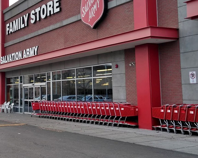 The red shopping carts lined up like eager treasure hunters, ready for their next adventure at this unassuming brick fortress of finds.