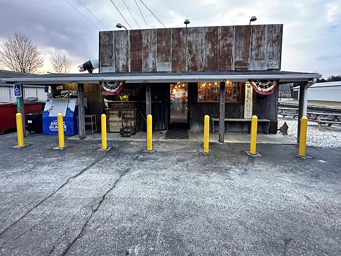 Rustic doesn't begin to describe this weathered roadside gem. Those yellow bollards aren't just decorative—they're keeping hungry Hoosiers from driving straight through to the brisket.