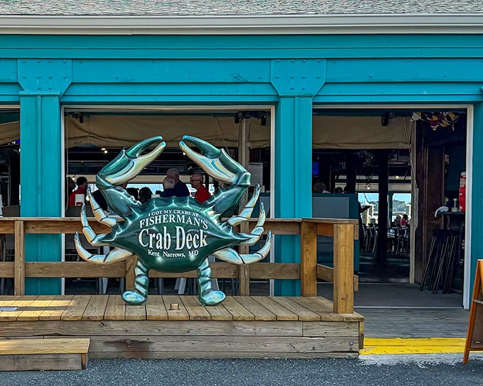 The iconic blue crab sculpture welcomes you to seafood paradise, standing guard like the Chesapeake Bay's unofficial mascot.