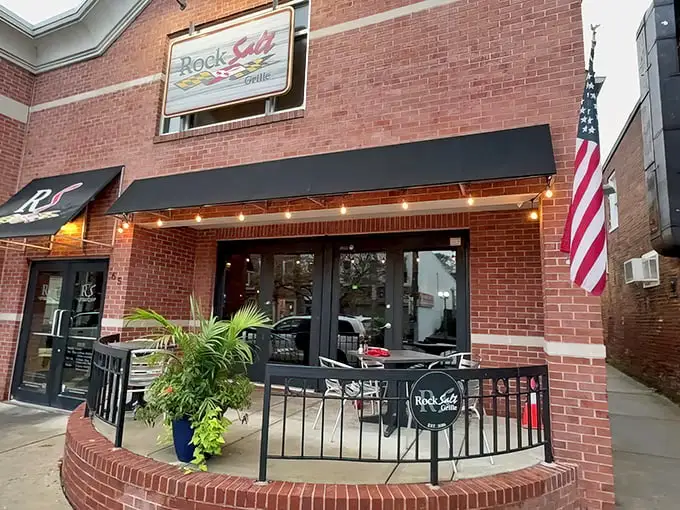 The brick façade and modest black awning of RockSalt Grille hide Westminster's seafood sanctuary like a pearl in an unassuming oyster.