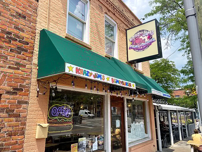 The unmistakable green awning and colorful signage of Blimpy Burger – Ann Arbor's burger institution where the rules are as distinctive as the food.