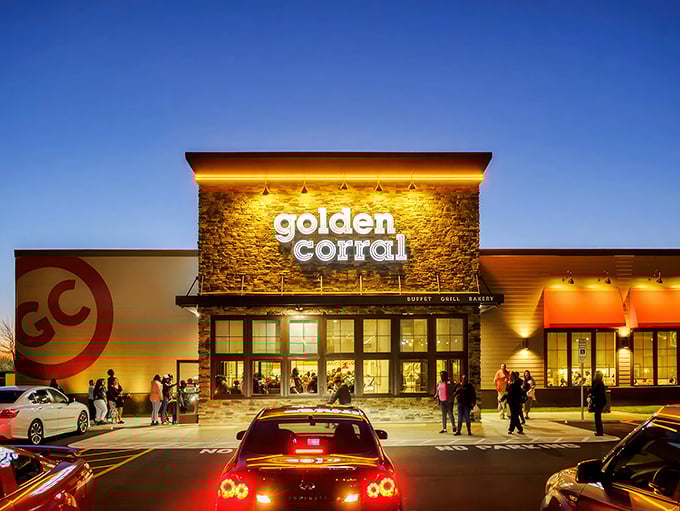 The golden glow of possibility! As dusk settles, this O'Fallon landmark beckons hungry travelers with promises of unlimited culinary adventures inside.