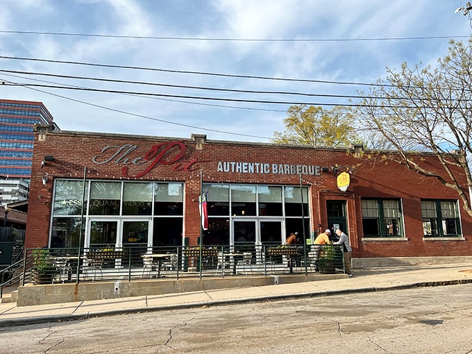 The brick exterior of The Pit stands like a temple to smoked meat, its unassuming façade hiding flavor explosions waiting to happen inside.