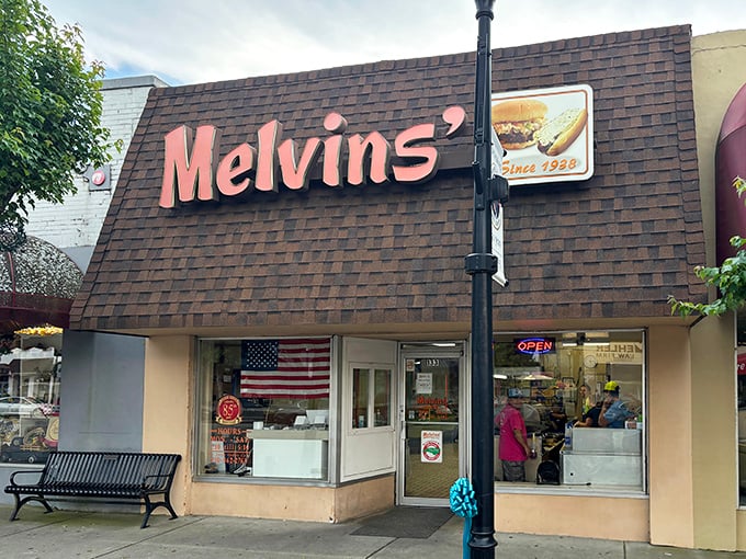 The iconic Melvin's storefront beckons hungry travelers with its vintage sign and simple promise: real food without the fuss. Small-town America at its most delicious.