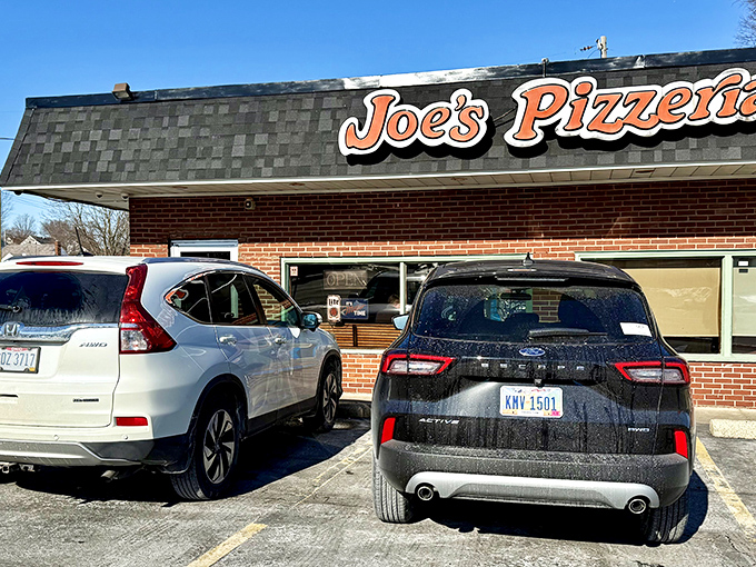 The unassuming brick fortress of flavor that is Joe's Pizzeria stands proudly on Airway Road, a beacon to pizza pilgrims for over six decades.
