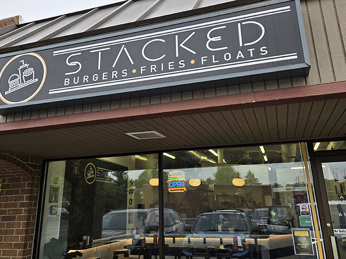 Stacked's bold blue signage promises a straightforward trinity of American comfort food classics: burgers, fries, and those glorious old-fashioned floats. 