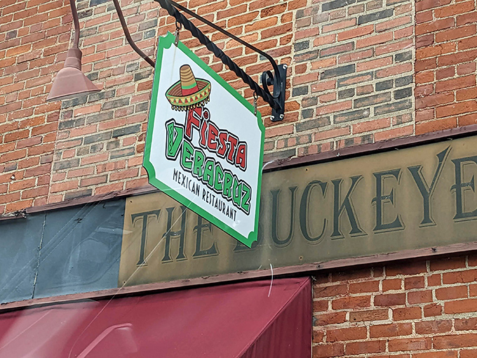 The iconic red awning and playful sombrero logo of Fiesta Veracruz beckon like an old friend saying, "Trust me, the tacos are worth it."