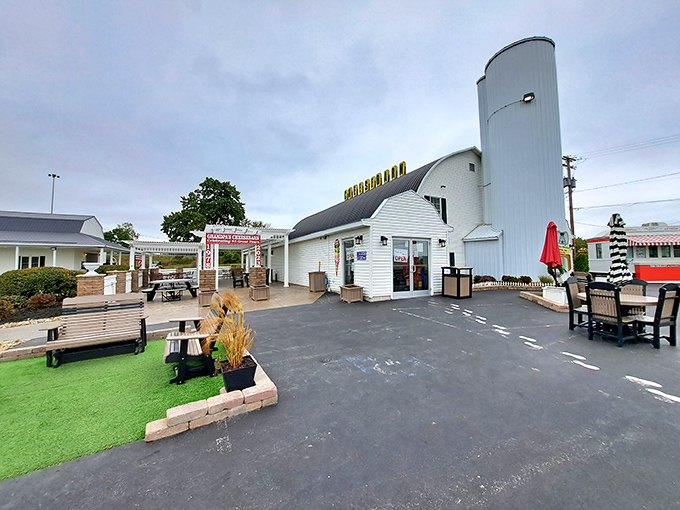 The iconic barrel-roofed Grandpa's Cheesebarn stands like a dairy cathedral just off I-71, promising roadtrippers salvation from mediocre snacks.
