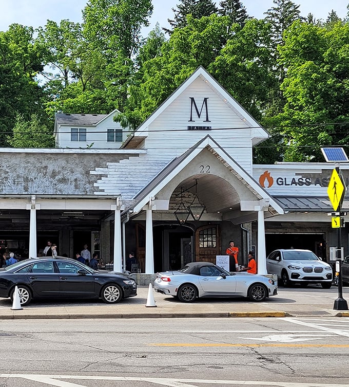 The iconic white facade of M Italian stands proudly in Chagrin Falls, where luxury vehicles often line up outside—a telltale sign you've found something special.