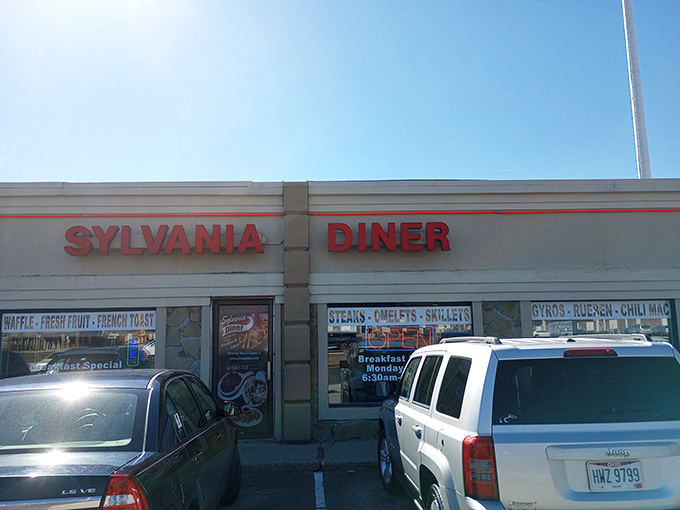 The unassuming storefront with bold red lettering belies the culinary treasures within. Like finding a diamond in a strip mall setting.