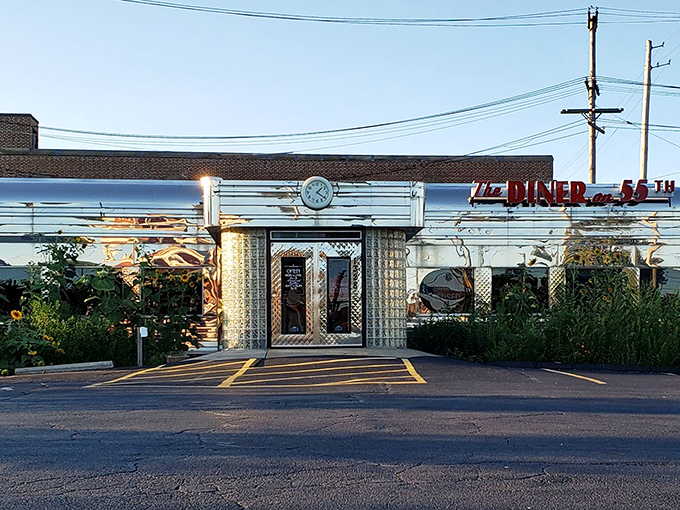That gleaming stainless steel exterior isn't just a facade—it's a time machine disguised as a diner. Classic glass blocks and neon signage promise authentic nostalgia inside.