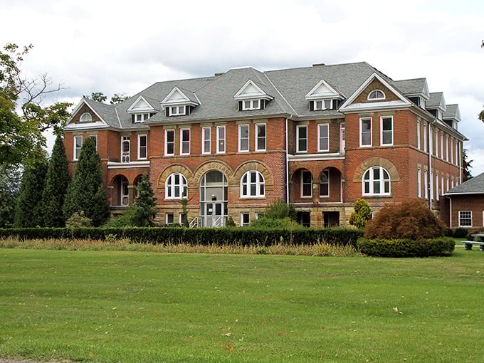 The imposing red brick façade of Madison Seminary stands proudly against the Ohio sky, its windows like watchful eyes surveying all who approach.