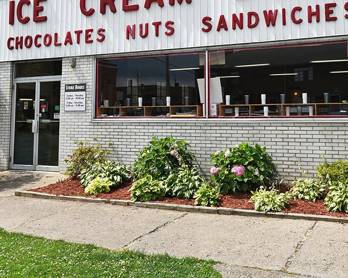 The classic white brick façade of Tom's Ice Cream Bowl stands as a time capsule of Americana, promising sweet memories and even sweeter treats inside.