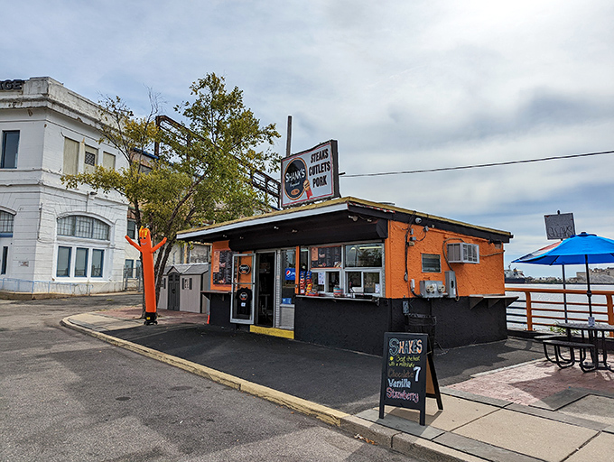 The unassuming exterior of Shank's Original stands like a culinary lighthouse on Pier 40, beckoning sandwich pilgrims with its simple promise: "STEAKS CUTLETS PORK."