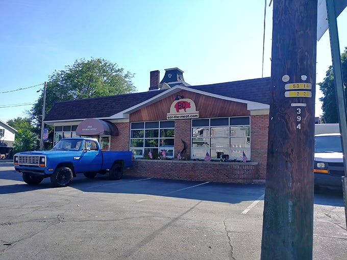 The blue pickup truck isn't just decoration—it's a beacon signaling you've arrived at barbecue nirvana in Swoyersville's unassuming brick building.