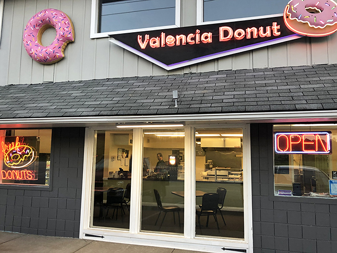 Those giant pink donuts flanking the storefront aren't just decoration—they're beacons of hope for the sugar-deprived traveler on Route 8.
